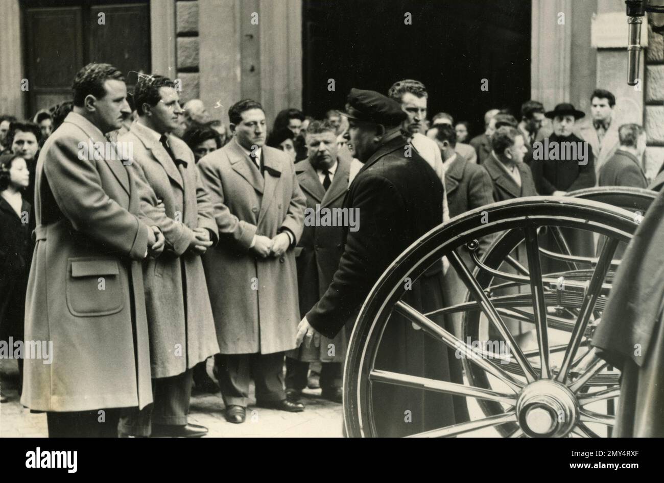 Traditional Italian catholic church funeral with wagon, procession and ...