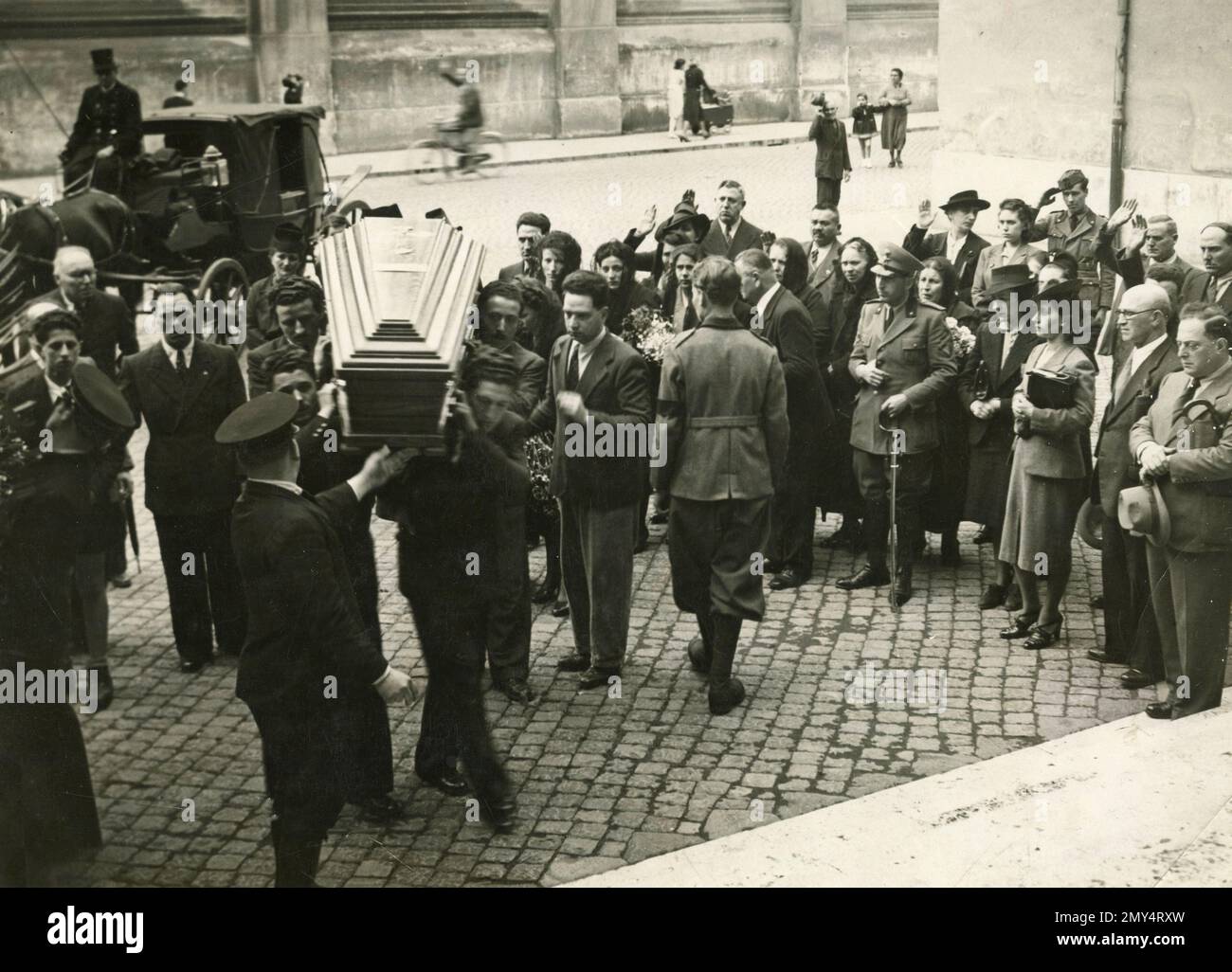 Men carrying the coffin at a funeral, Italy 1930s Stock Photo - Alamy