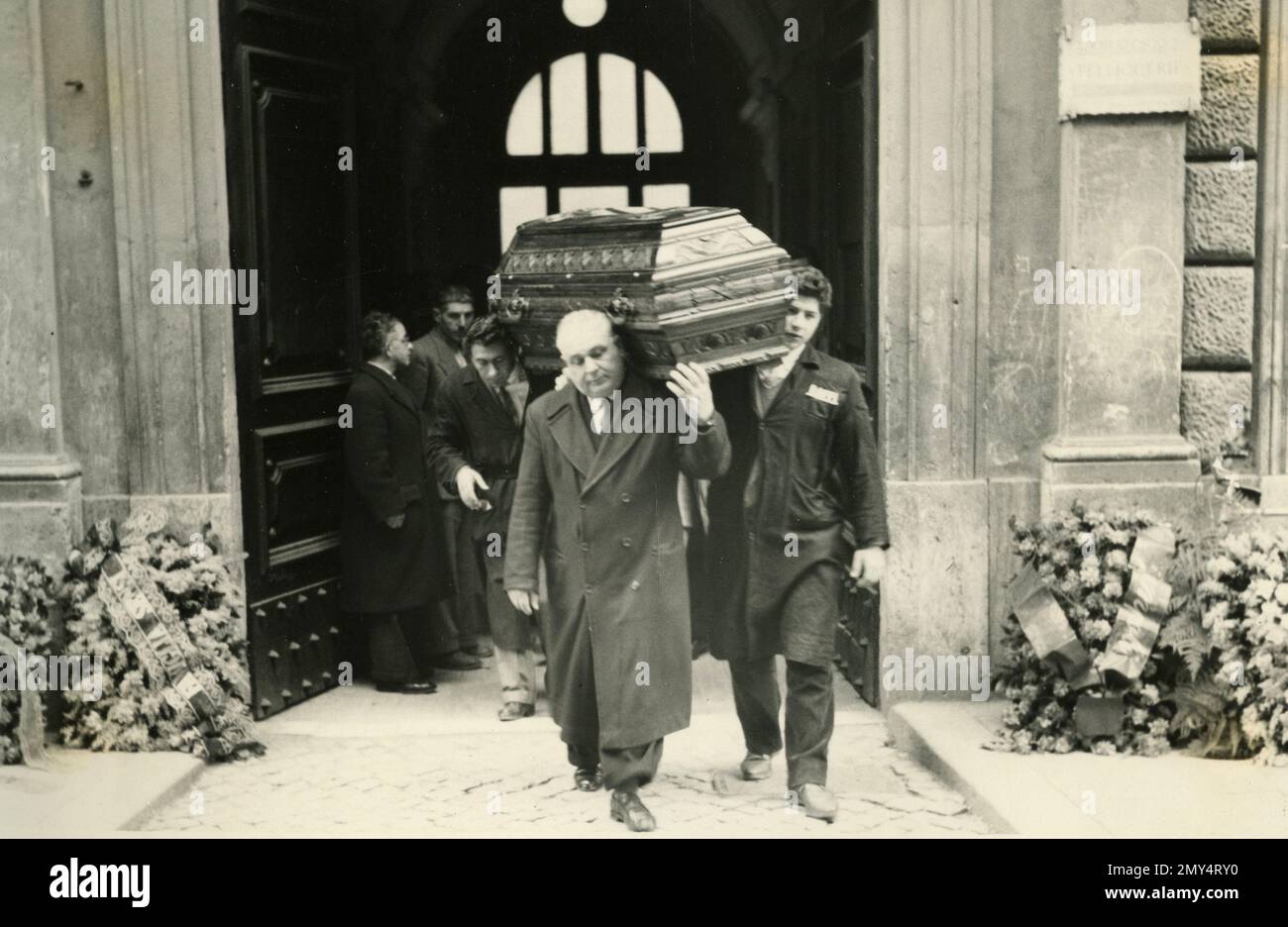 Traditional Italian catholic church funeral with wagon, procession and ...