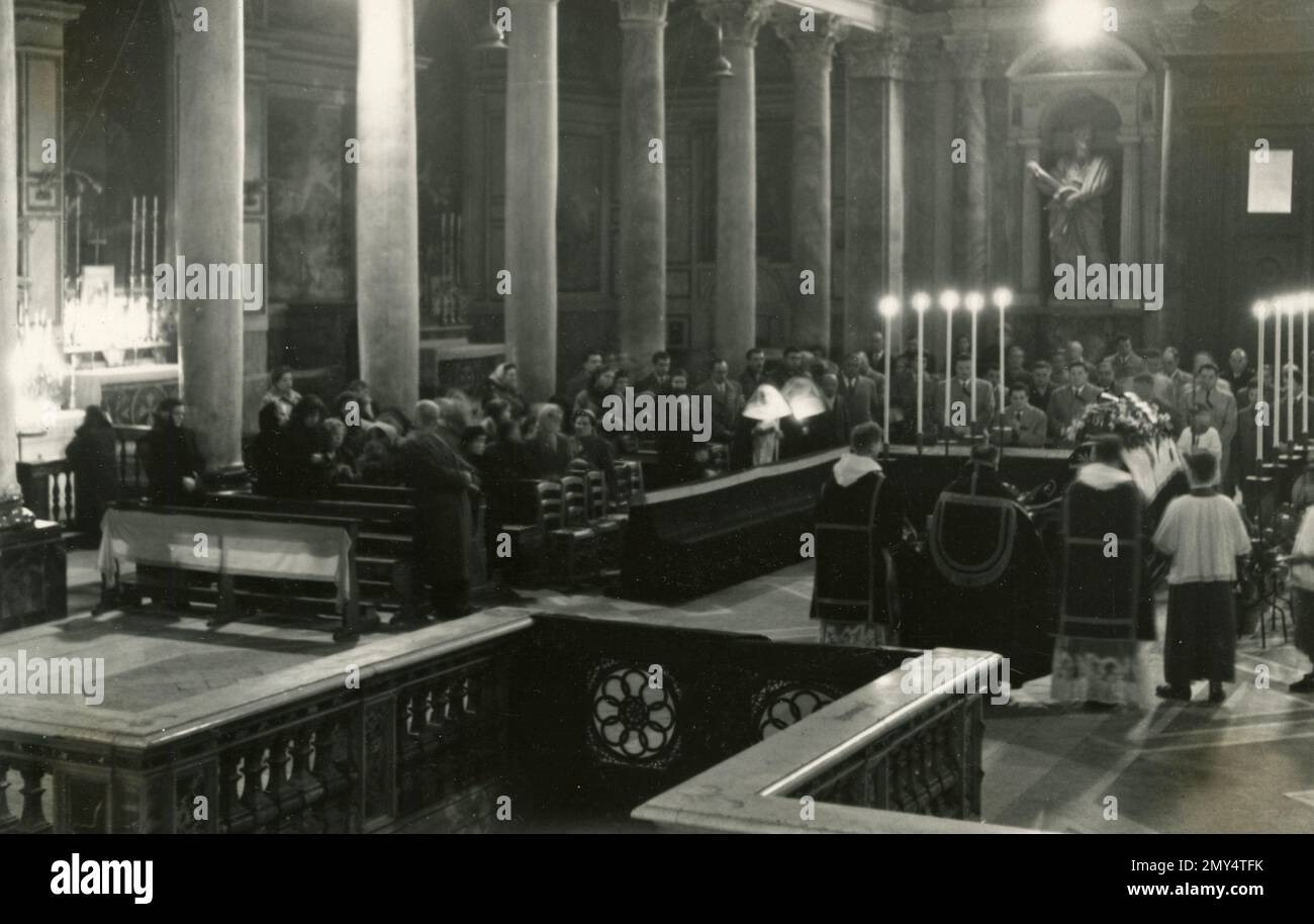 Traditional Italian catholic church funeral with wagon, procession and ...