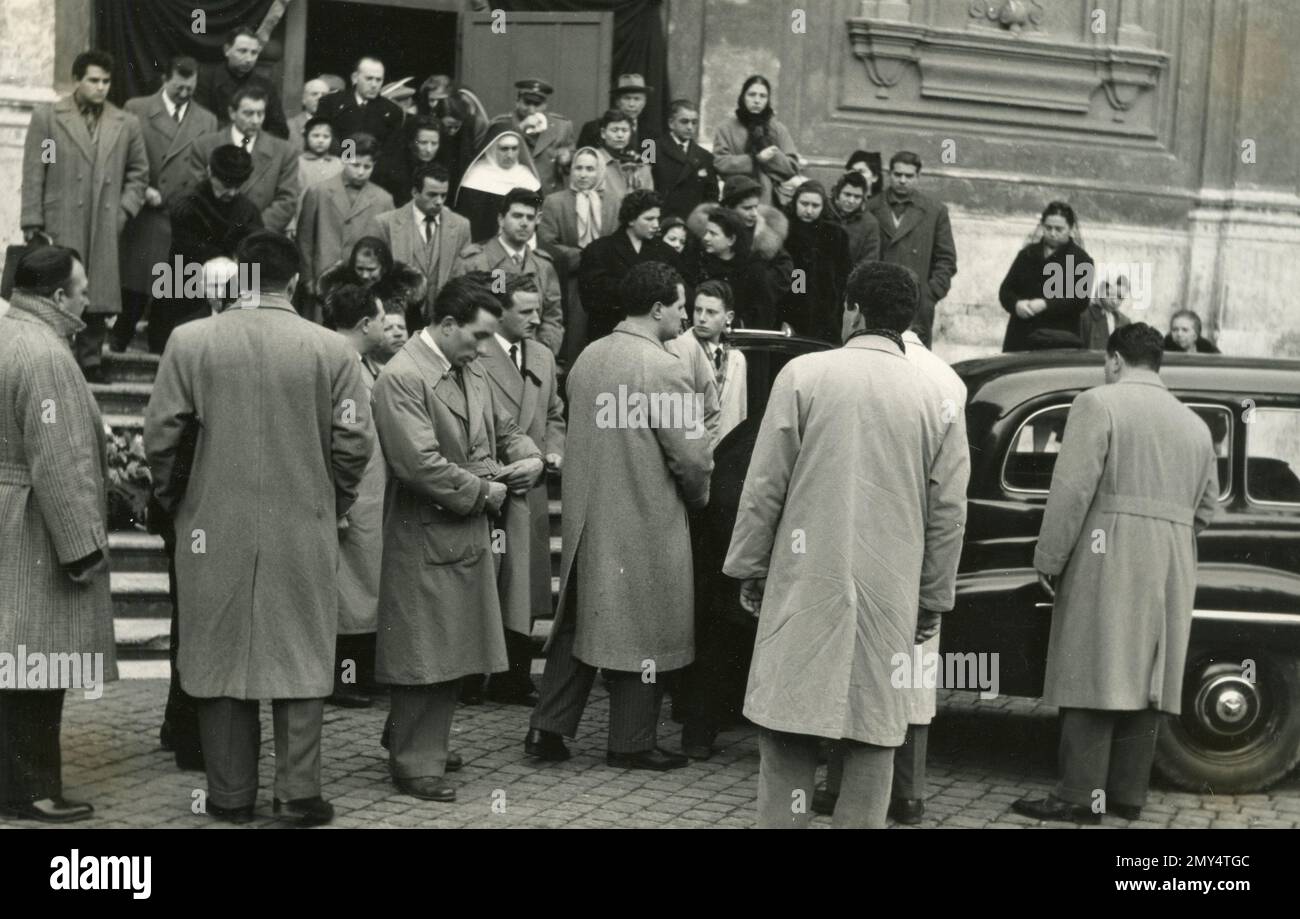 Traditional Italian catholic church funeral with wagon, procession and ...