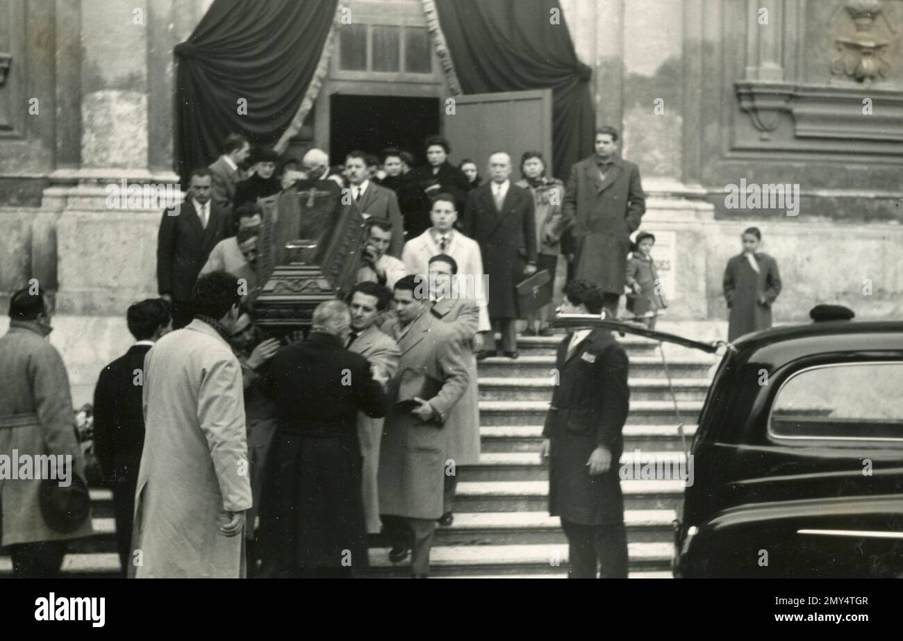 Traditional Italian catholic church funeral with wagon, procession and ...