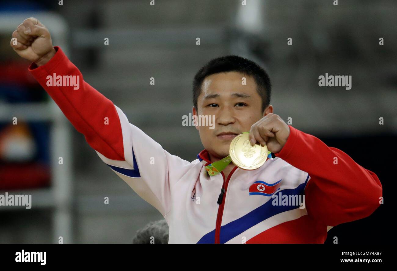 North Korea's Ri Se Gwang celebrates after receiving his gold medal for ...