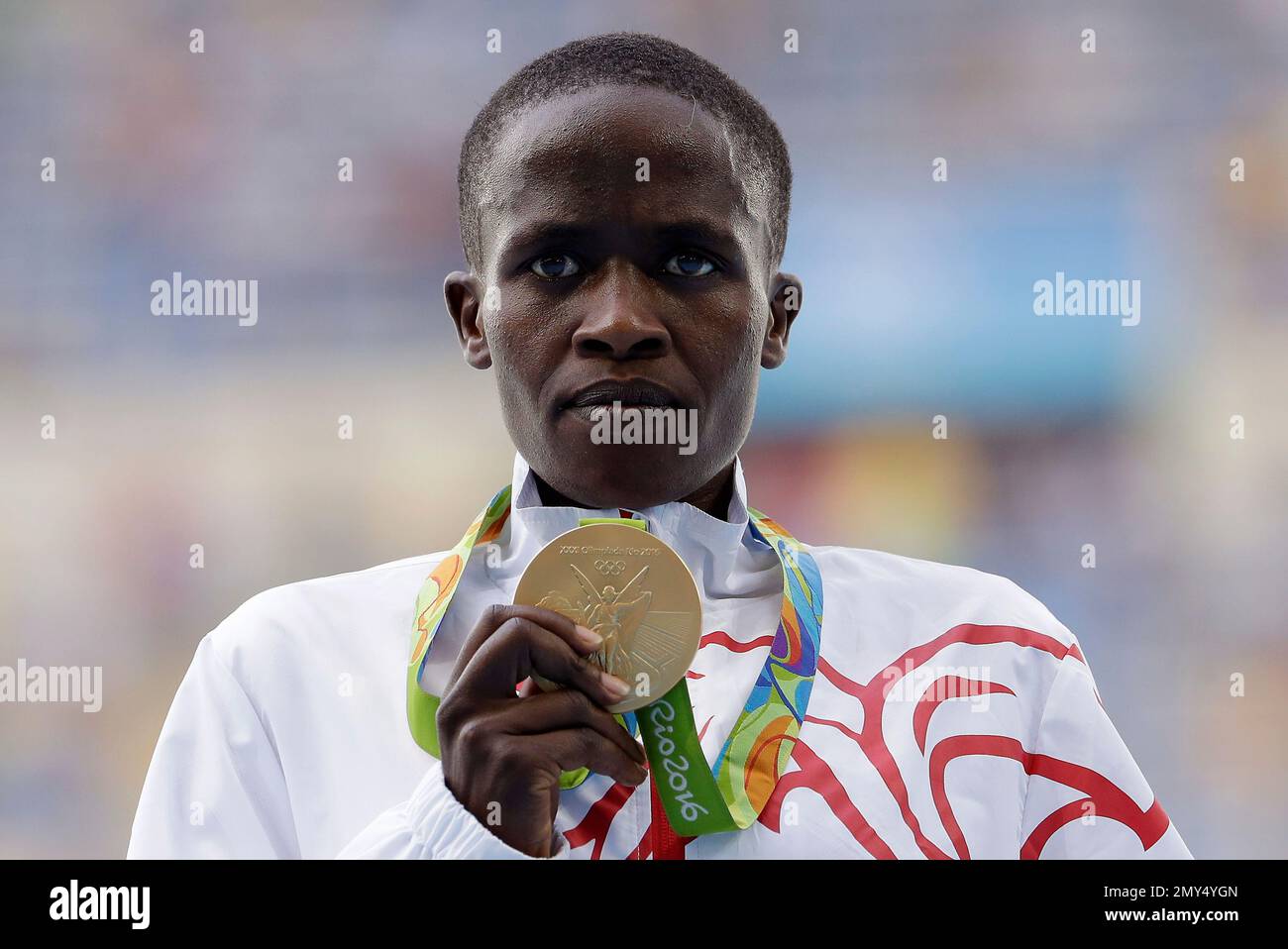 Bahrain's Ruth Jebet shows off her gold medal during the ceremony for ...