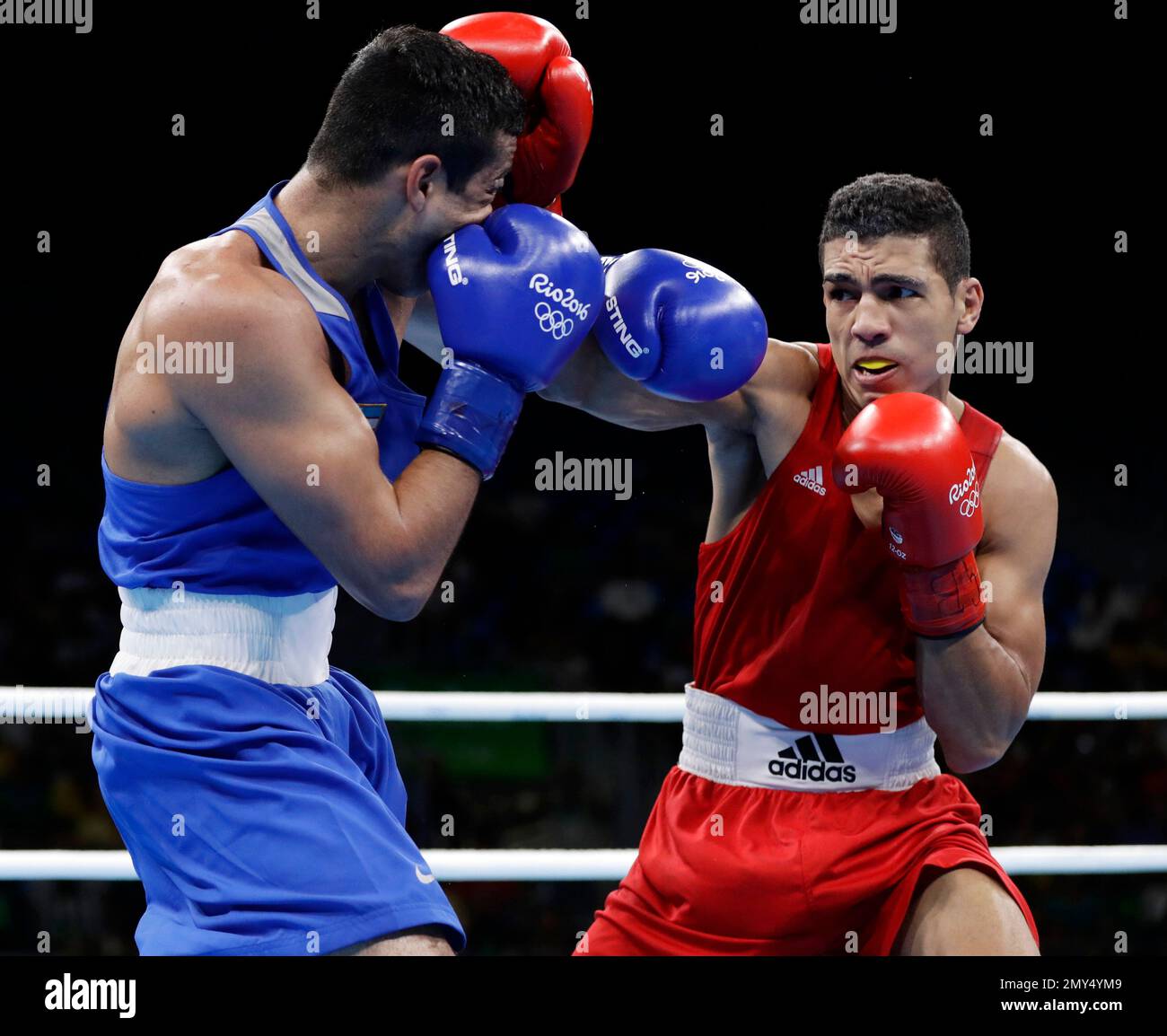 Morocco's Mohammed Rabii, right, fights Uzbekistan's Shakhram Giyasov ...