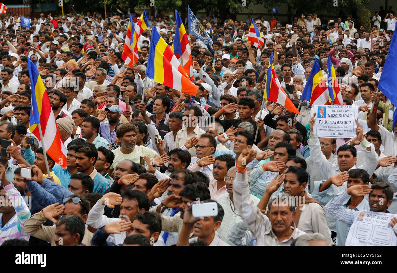 Members of India’s low-caste Dalit community salute the Indian flag ...