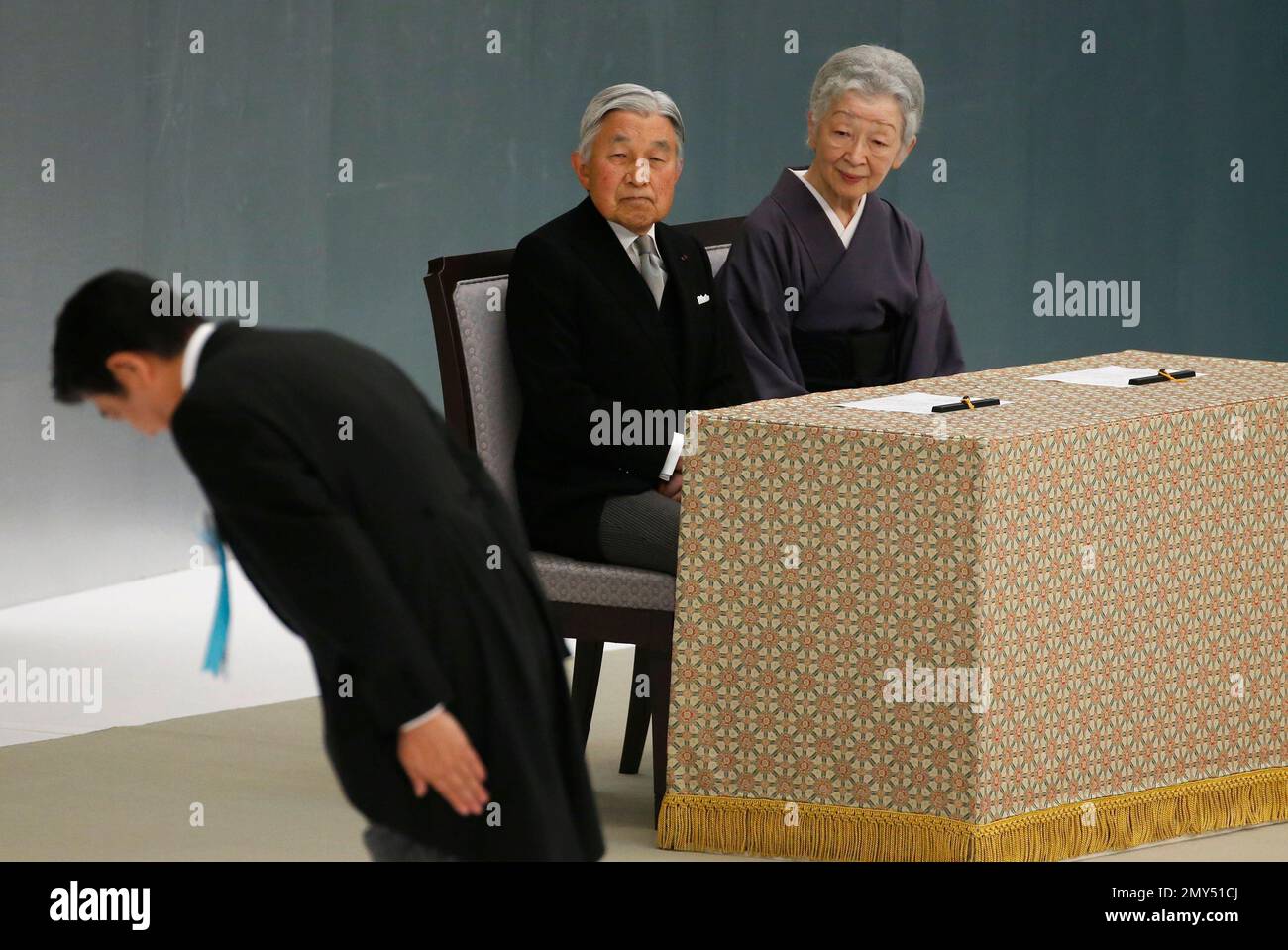 Japanese Prime Minister Shinzo Abe, left, bows in front of the main ...
