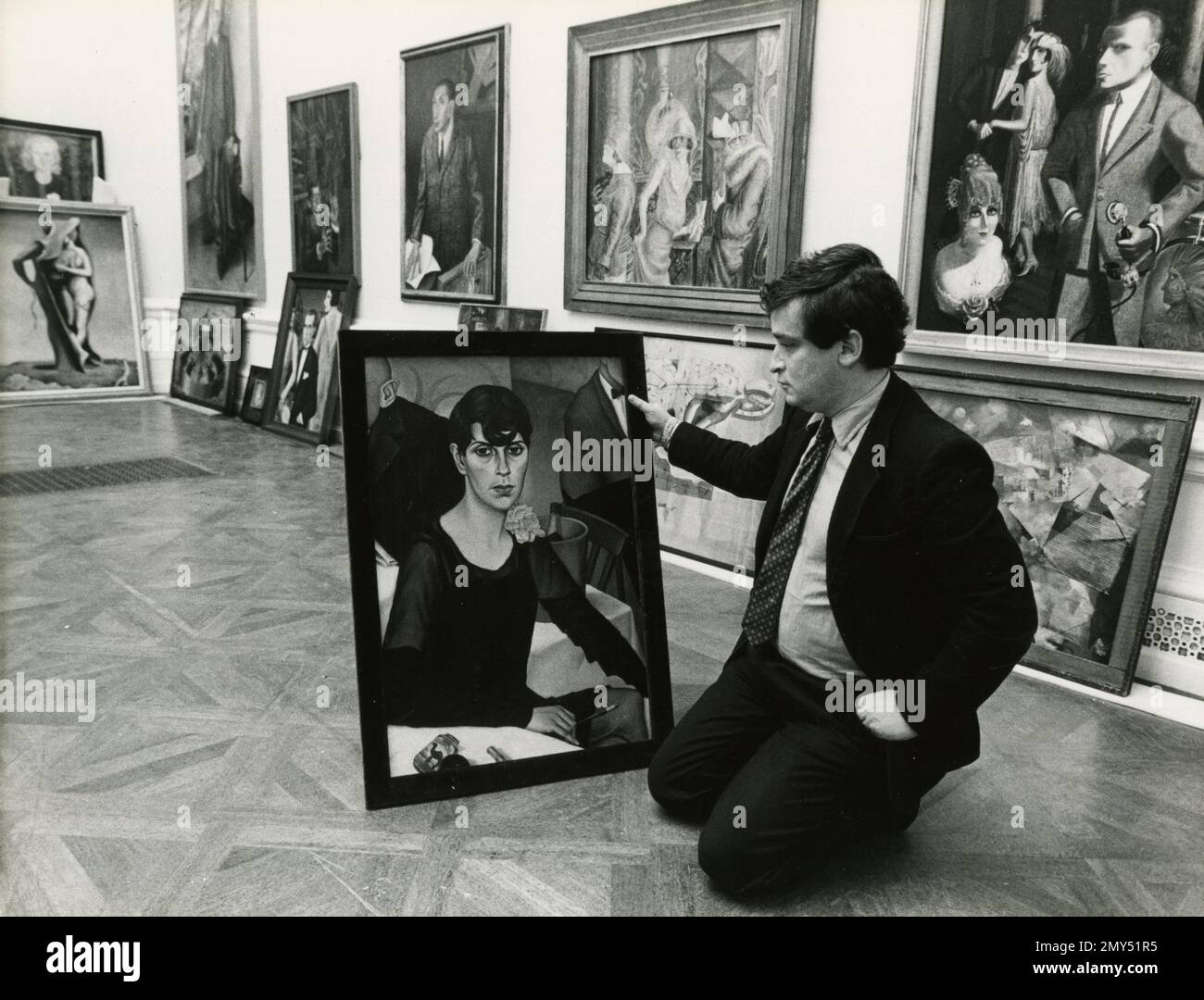 Royal Academy Exhibition Secretary Norman Rosenthal, looking at a ...