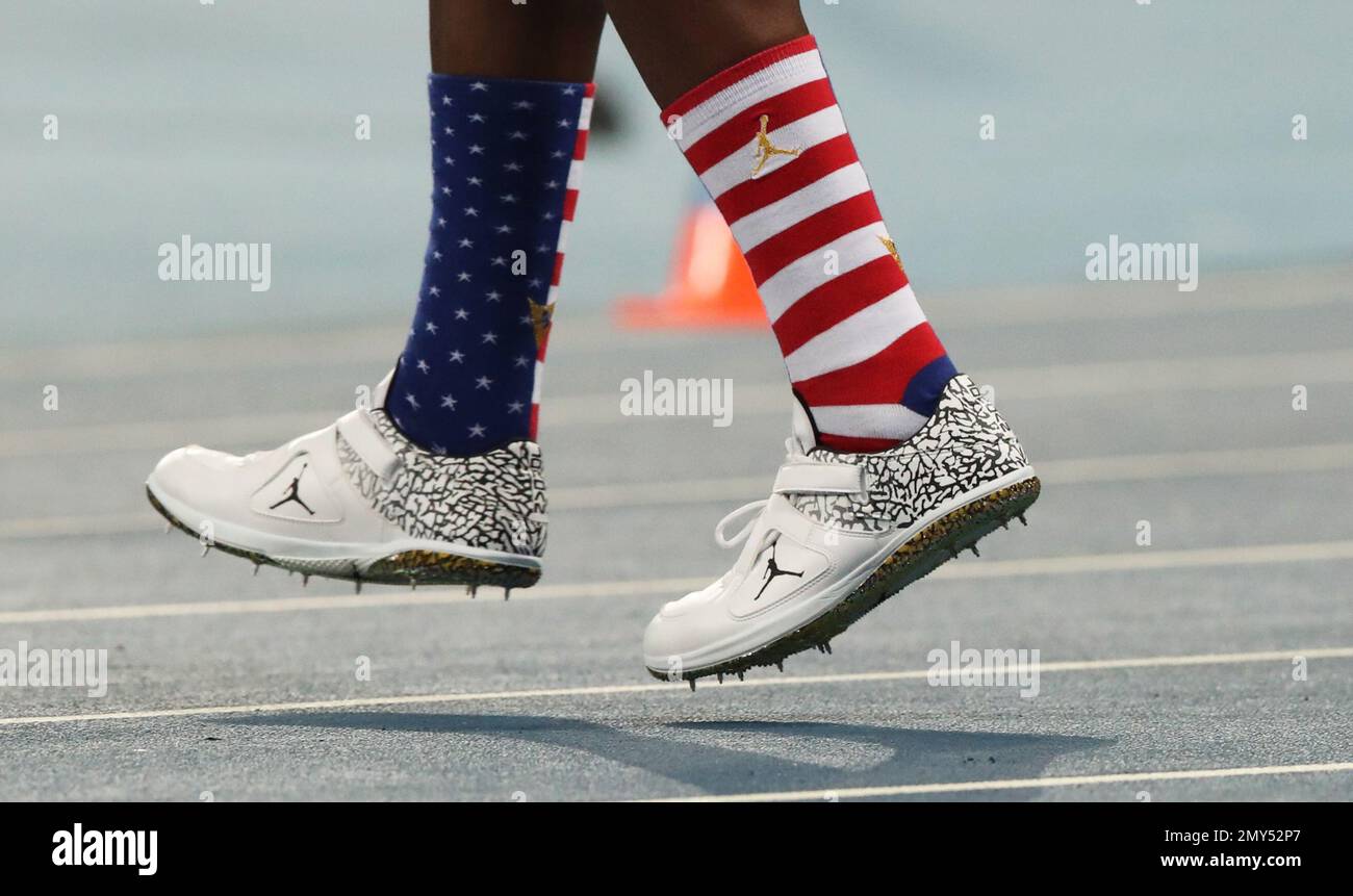 United States' high jumper Erik Kynard wears socks in the colors of his ...