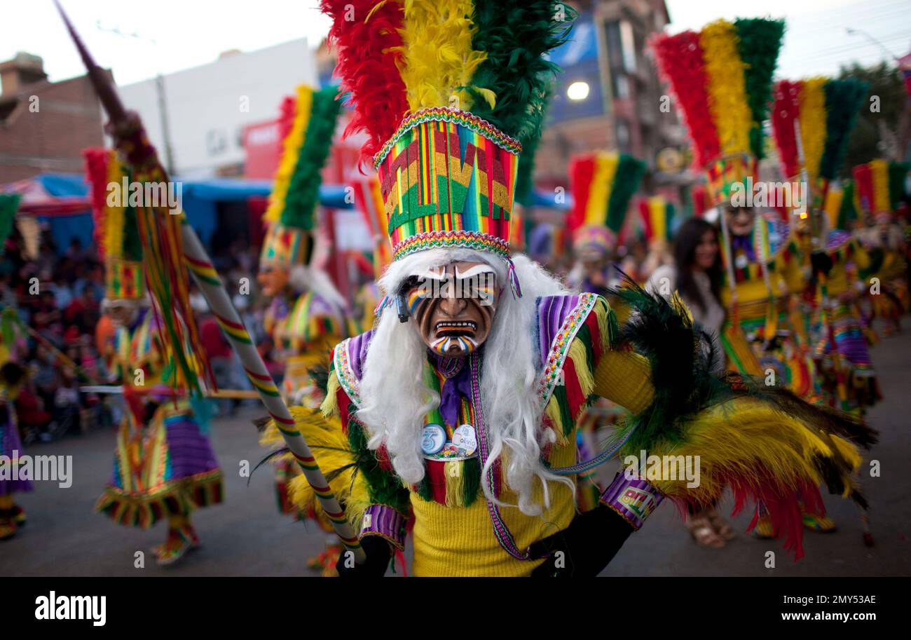 Members of the Tobas dance troupe perform during the traditional ...