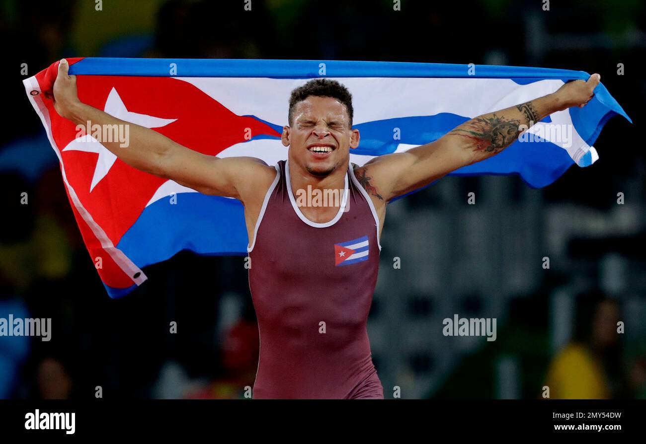Cuba's Ismael Borrero Molina celebrates after winning the gold medal of ...