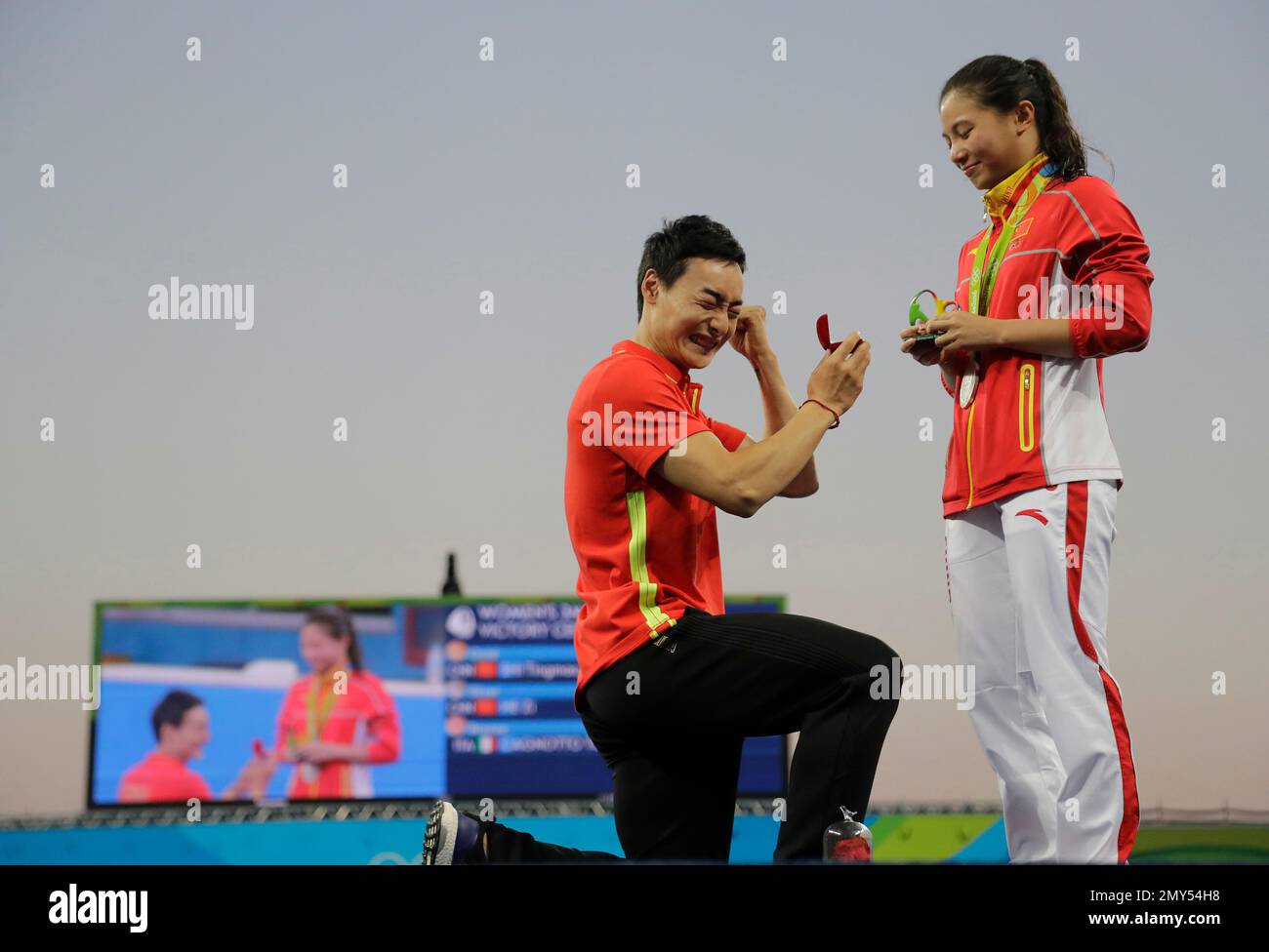 China's diver Qin Kai, left, cheers after silver medalist He Zi of the ...