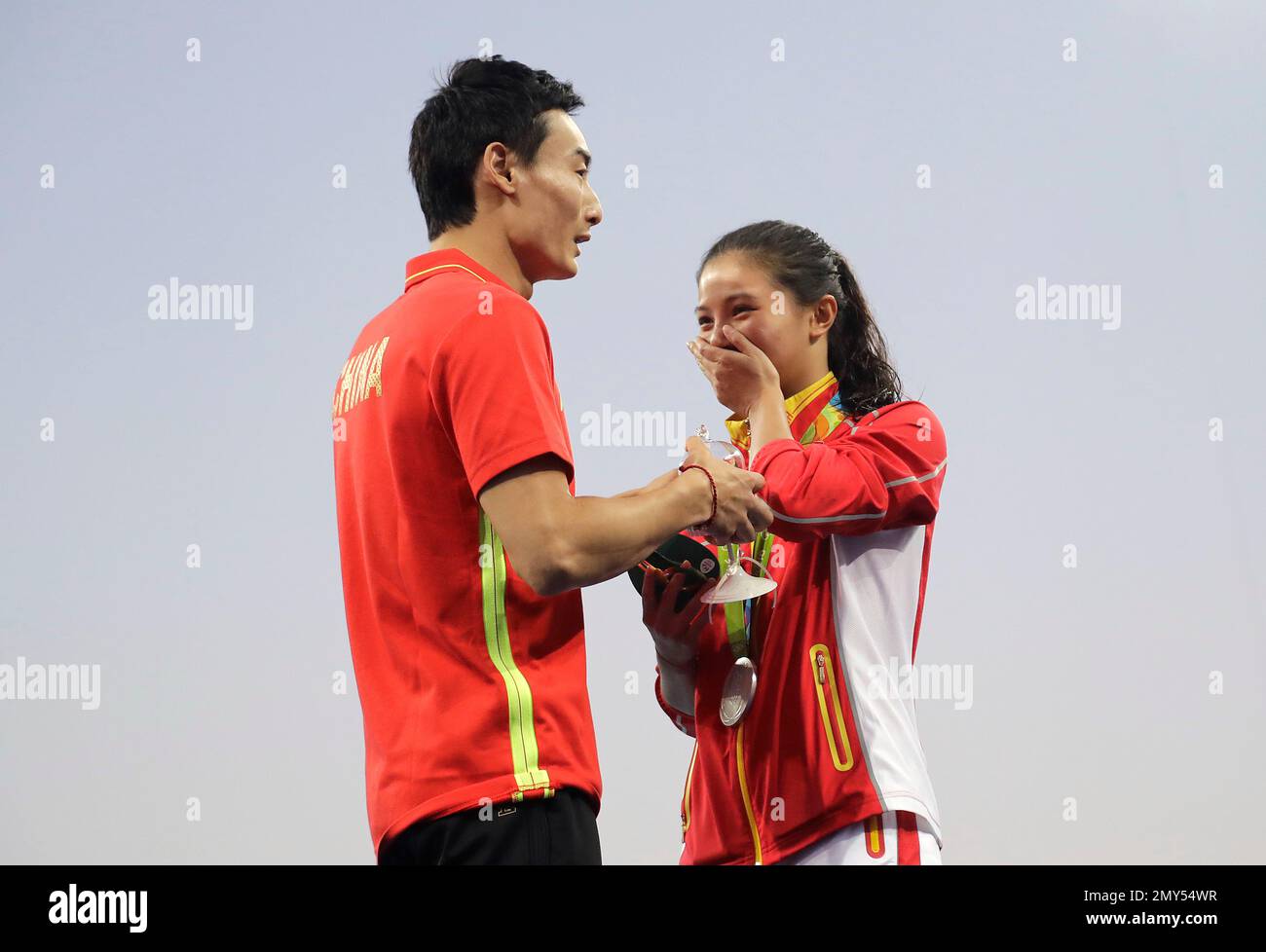 China's diver Qin Kai, left, proposes to silver medalist He Zhi of the ...