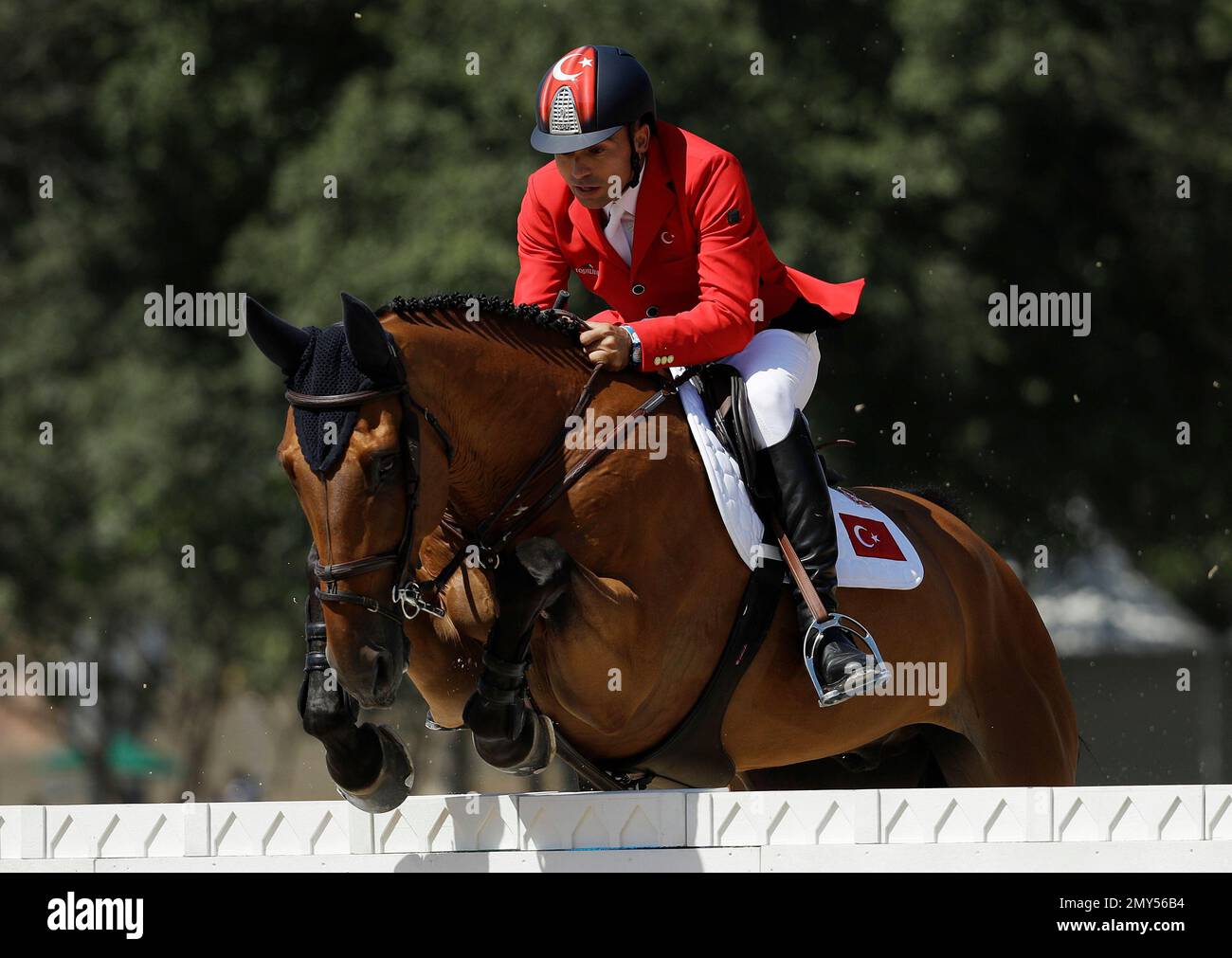 Turkey's Omer Karaevli, riding Roso Au Crosnier, competes in the ...