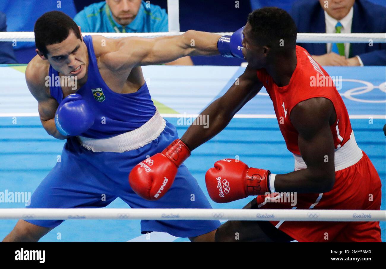 Brazil's Michel Borges, left, fights Cuba's Julio Cesar La Cruz during ...