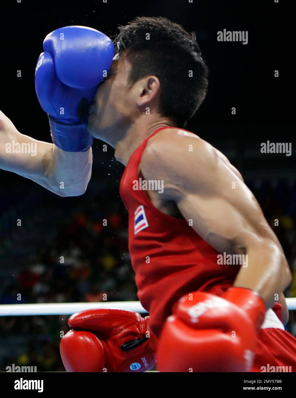 Thailand's Chatchai Butdee is hit by Russia's Nikitin Vladimir during a ...