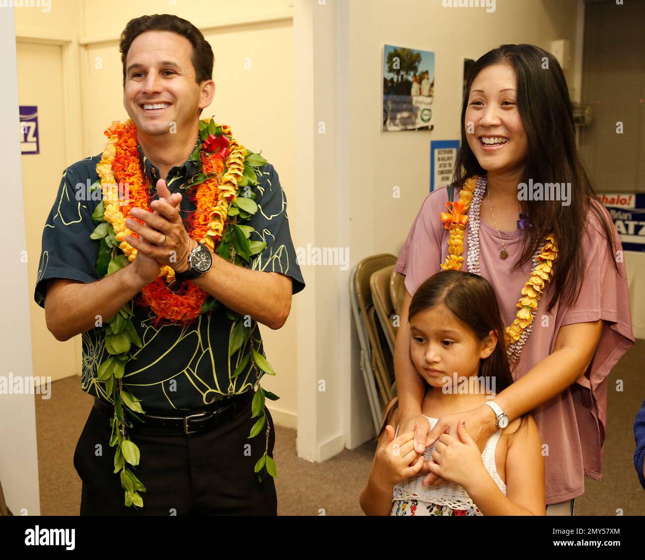 US Sen. Brian Schatz, left, his wife Linda Schatz, and their daughter ...