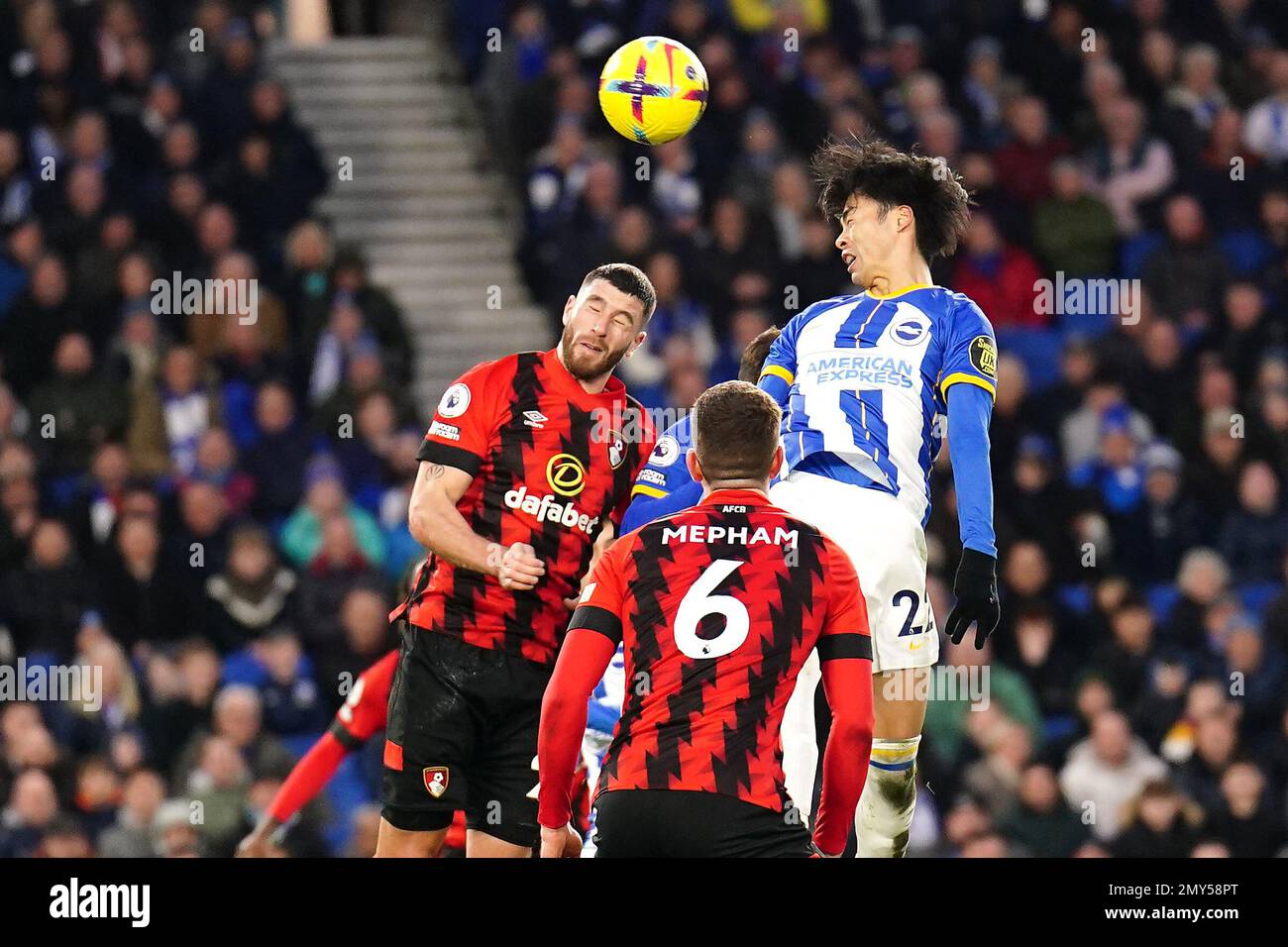 Brighton and Hove Albion's Kaoru Mitoma (right) scores their side's ...