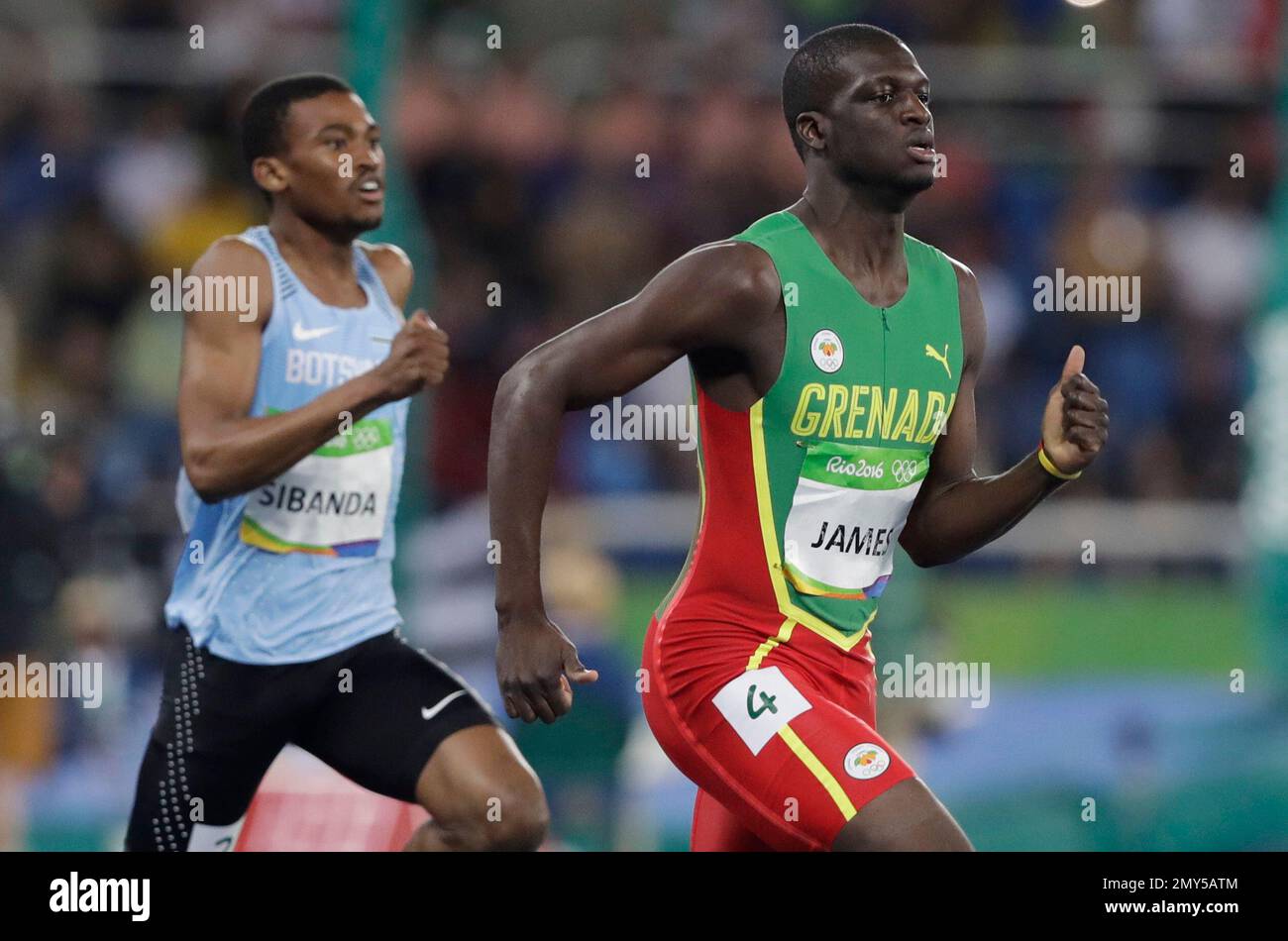 Grenada's Kirani James, right, and Botswana's Karabo Sibanda compete in ...