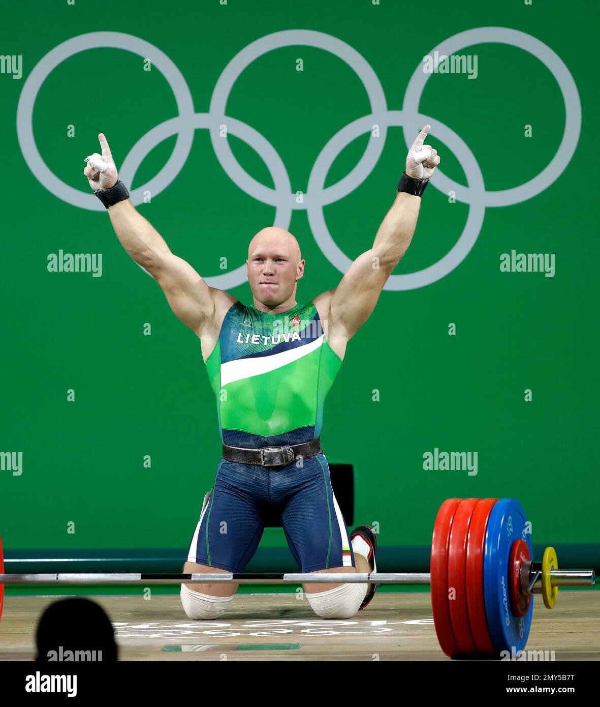 Aurimas Didzbalis, of Lithuania, celebrates after his final lift in the ...