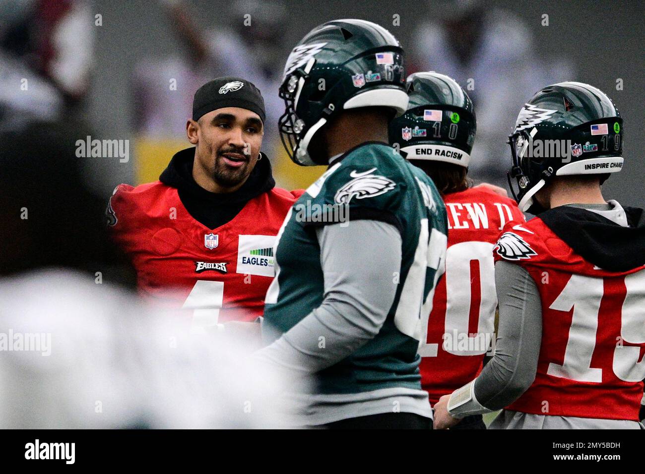 Philadelphia Eagles' Jalen Hurts, left, talks to teammates during ...