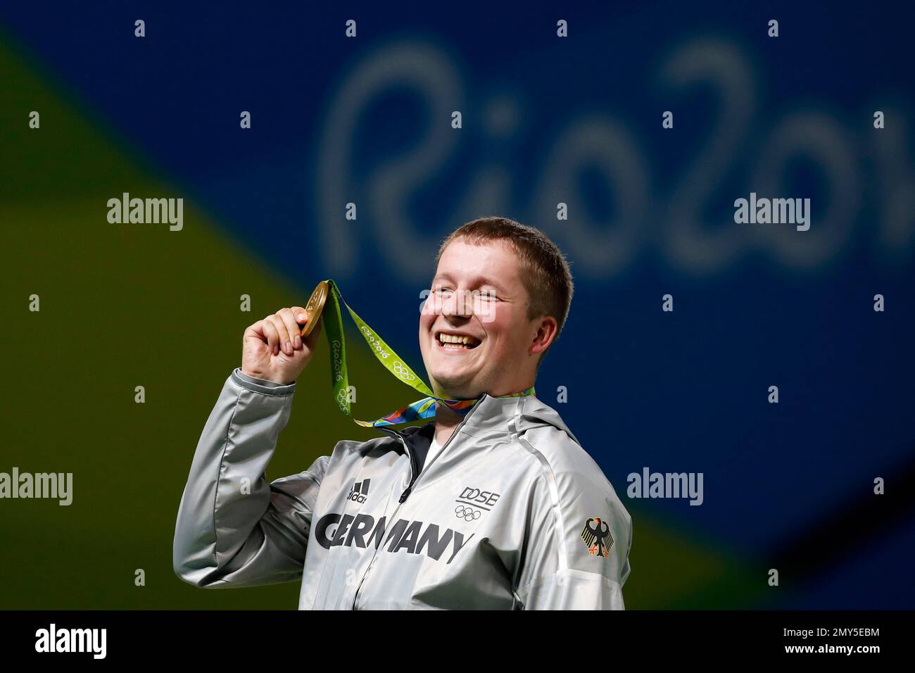 Christian Reitz of Germany displays his gold medal during the victory ...