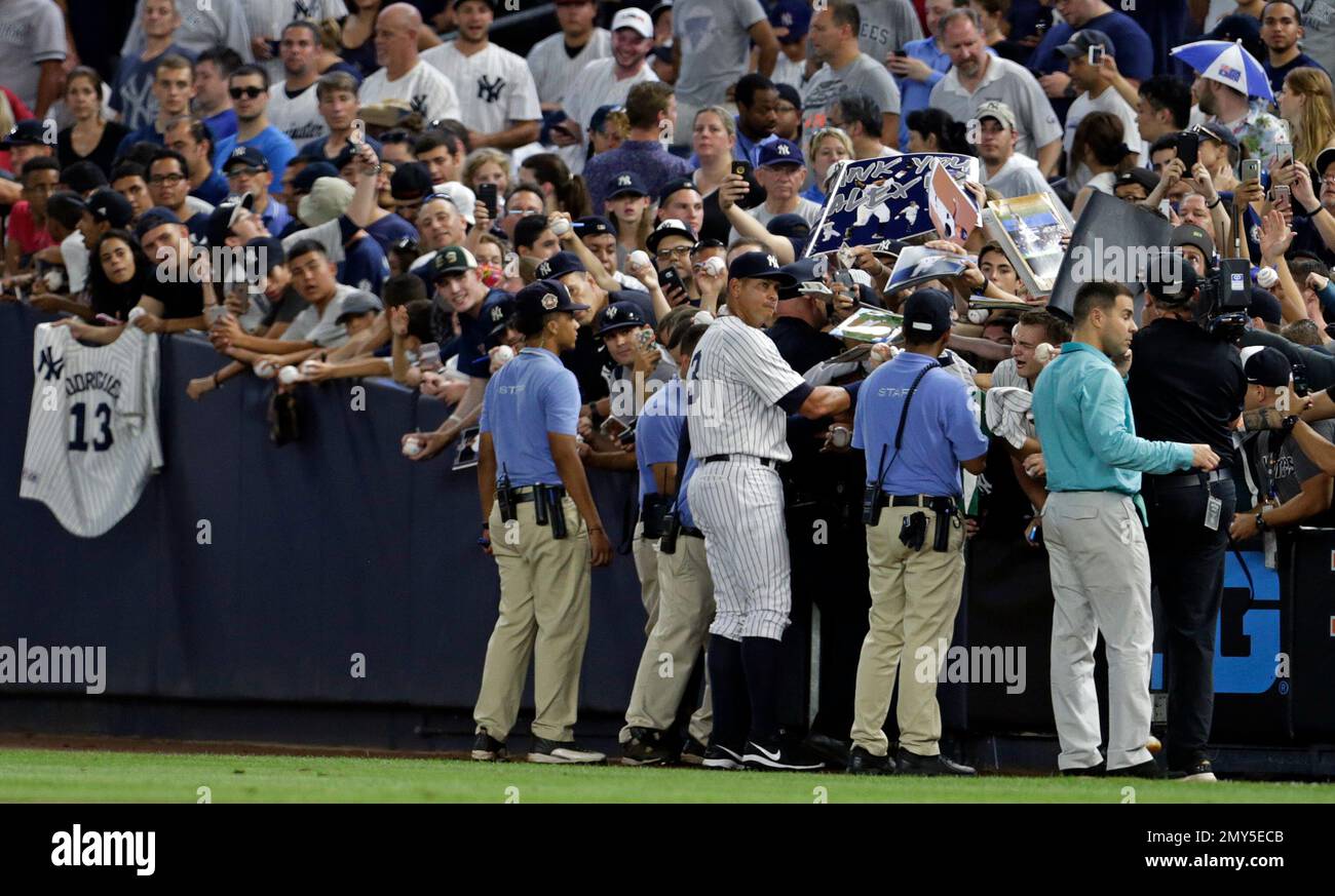 New York Yankees' Alex Rodriguez signs autographs prior to his final ...