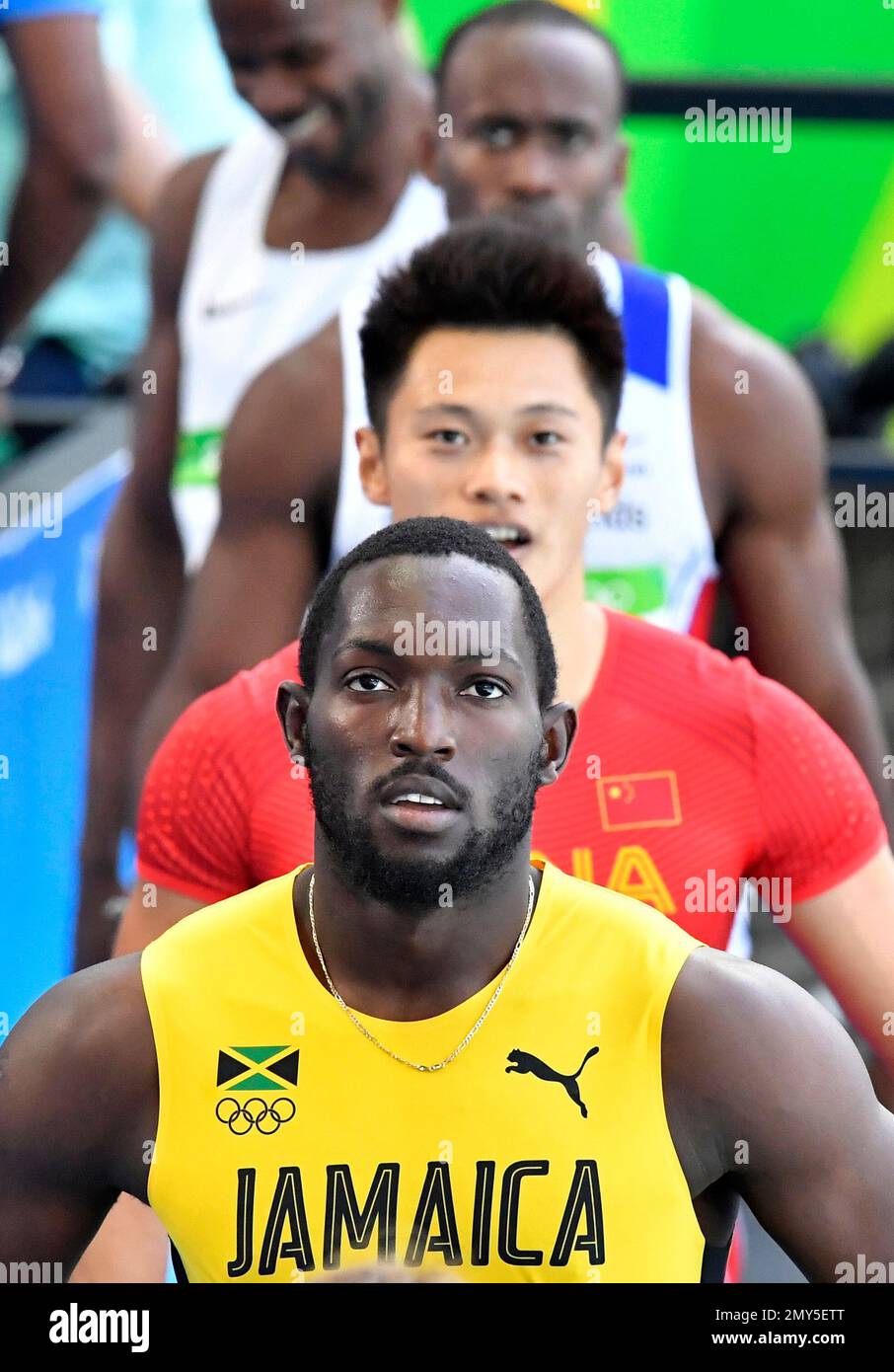 Jamaica's Nickel Ashmeade with other athletes, leave the stadium after ...