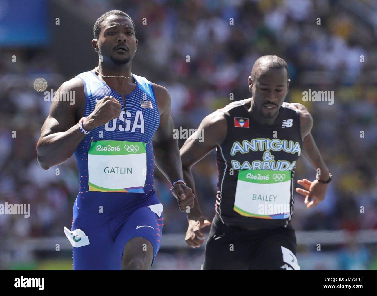 United States' Justin Gatlin, left, and Antigua & Barbuda's Daniel ...