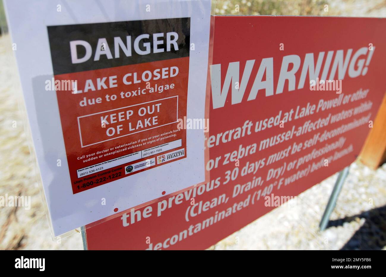 FILE - This July 20, 2016, file photo, a A danger lake closed sign is ...