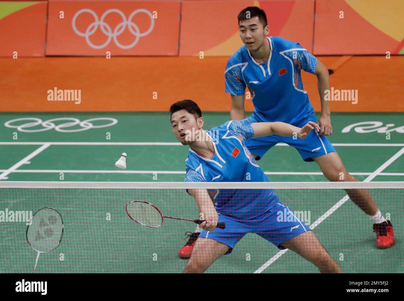 China's Hong Wei, left, and Chai Biao return a shot to Indonesia's ...