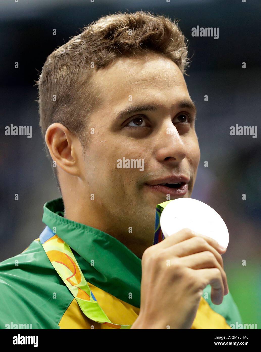South Africa's Chad Le Clos shows off his silver medal in the men's 100 ...