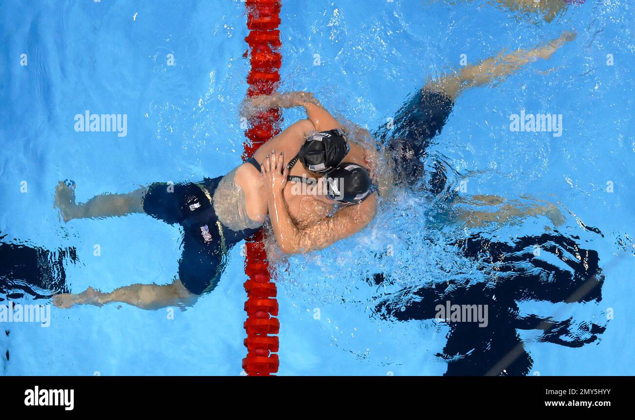 United States' Katie Ledecky gets a hug from Leah Smith after breaking ...
