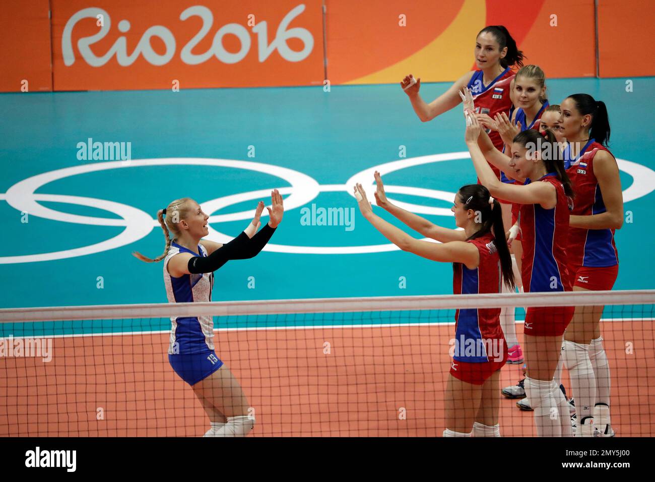 Russia's Anna Malova, left, runs to her teammates ahead of a women's ...