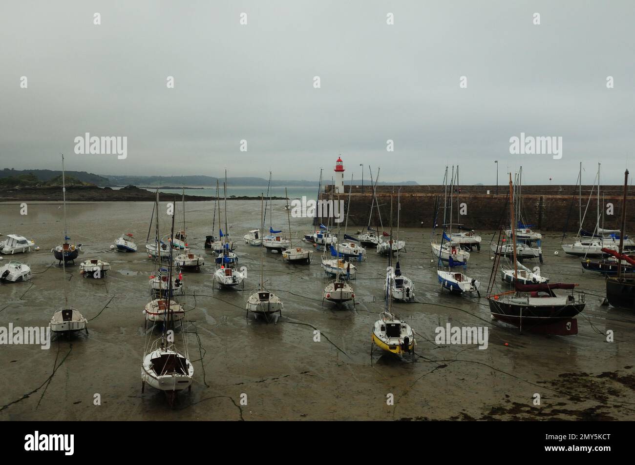 Boats Lying Aground During Low Tide In The Harbour Of Erquy In Bretagne ...