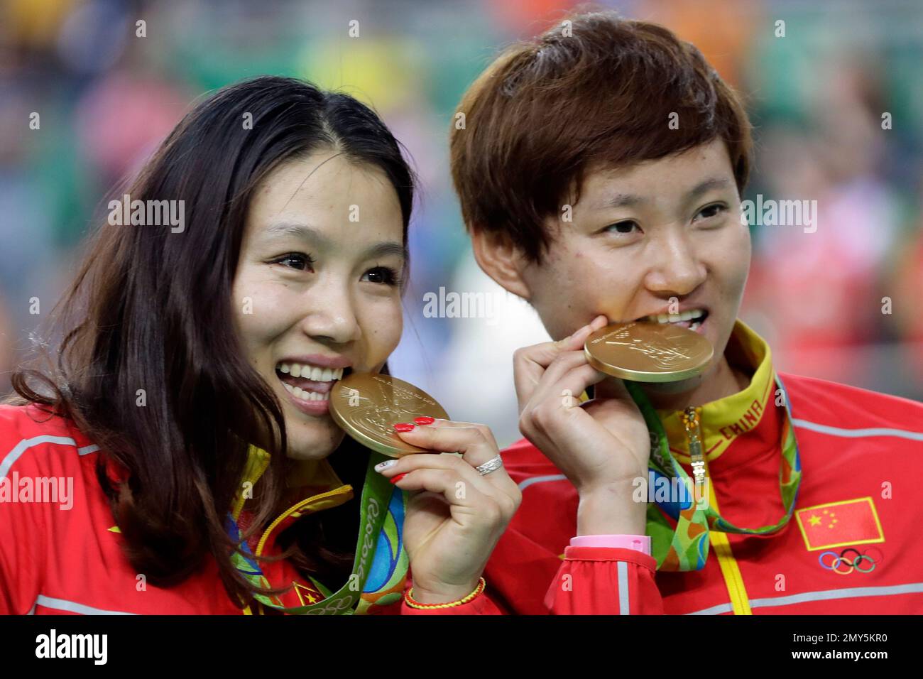 Jinjie Gong, left, and teammate Zhong Tianshi , right, of China pose ...