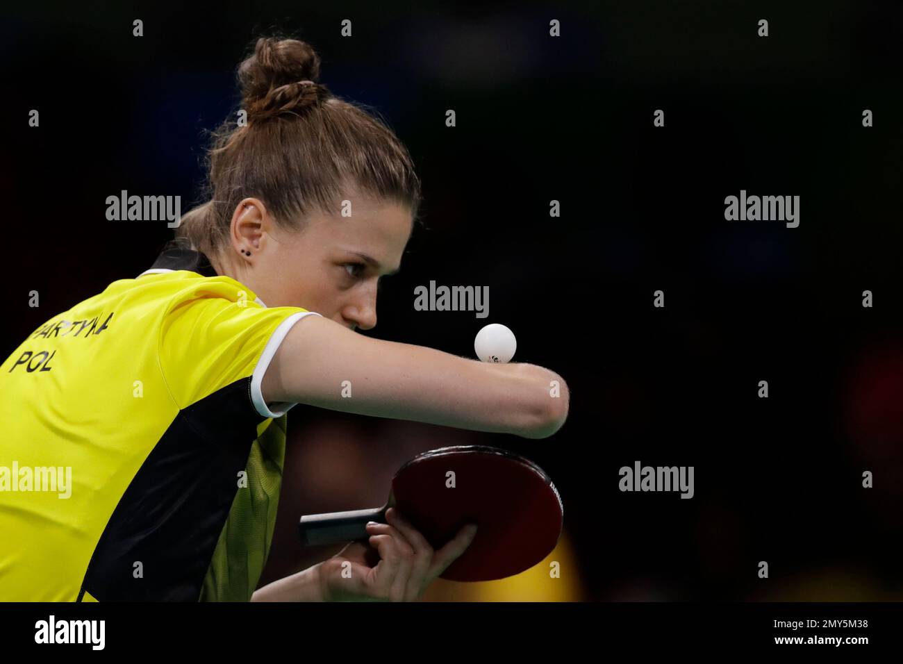 Natalia Partyka of Poland serves as she competes with her teammate ...