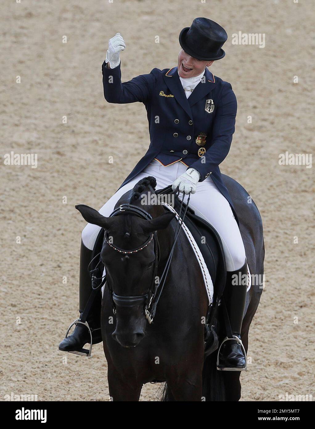 Germany's Isabell Werth, riding Weihegold Old, celebrates after she ...