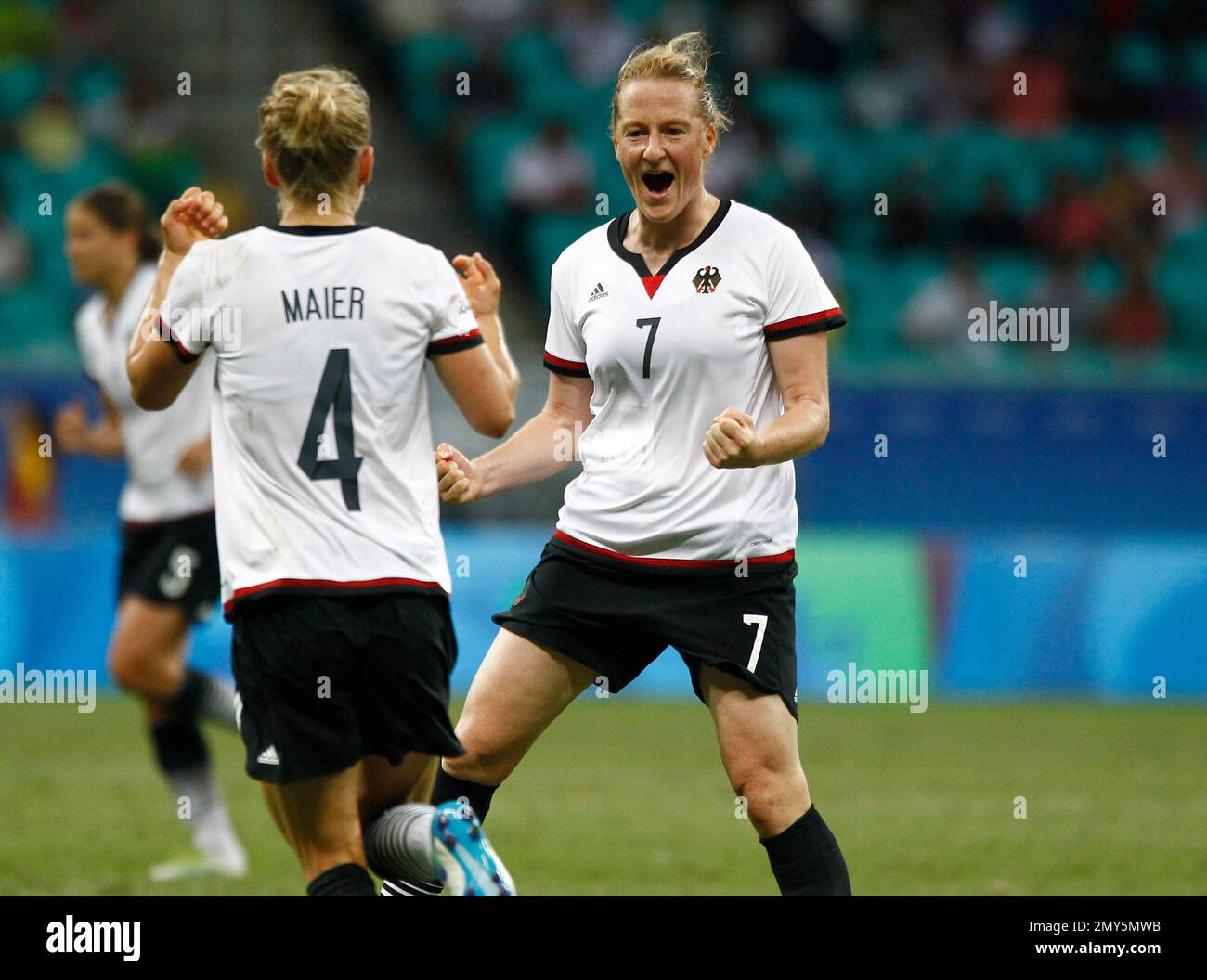 Germany's Melanie Behringer, right, celebrates her goal with teammate ...