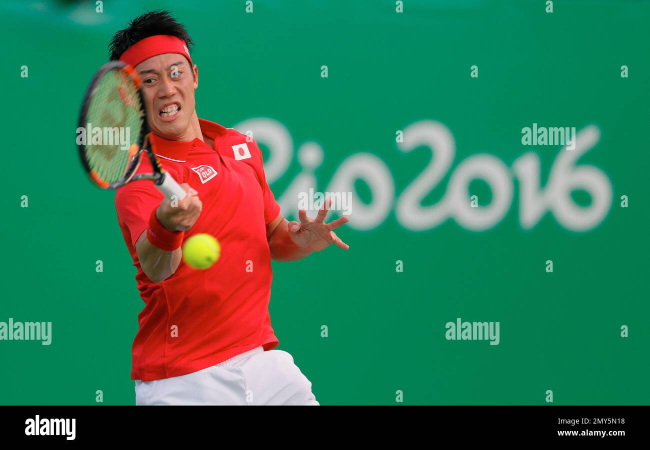 Japan's Kei Nishikori returns to France's Gael Monfils during the men's ...