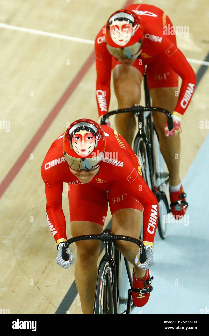Zhong Tianshi of China, front, and teammate Jinjie Gong compete in the ...