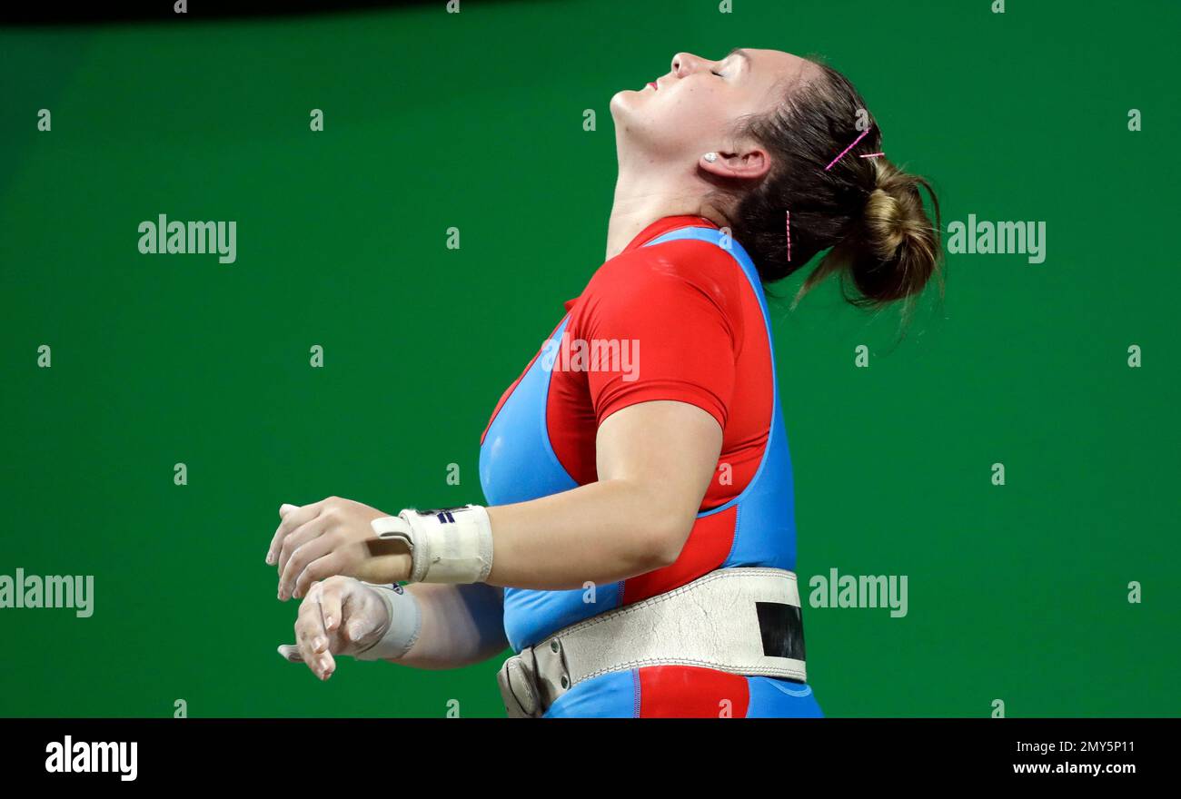 Maria Fernanda Valdes Paris, of Chile, walks away from the barbell ...