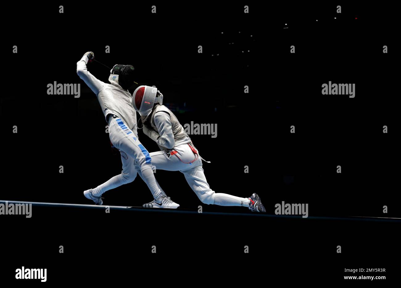 Daniele Garozzo of Italy, left, and Jeremy Cadot of France compete in a ...
