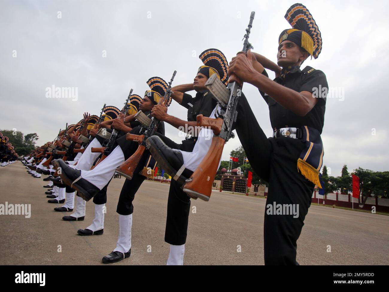 Newly inducted Indian army soldiers salute during their graduation ...