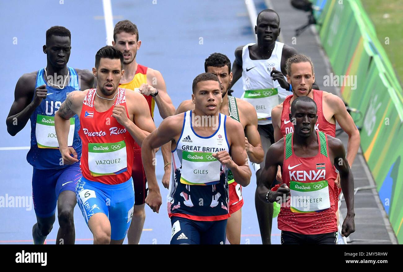 Yiech Pur Biel of the Refugee Olympic Team, rear right, runs at the ...