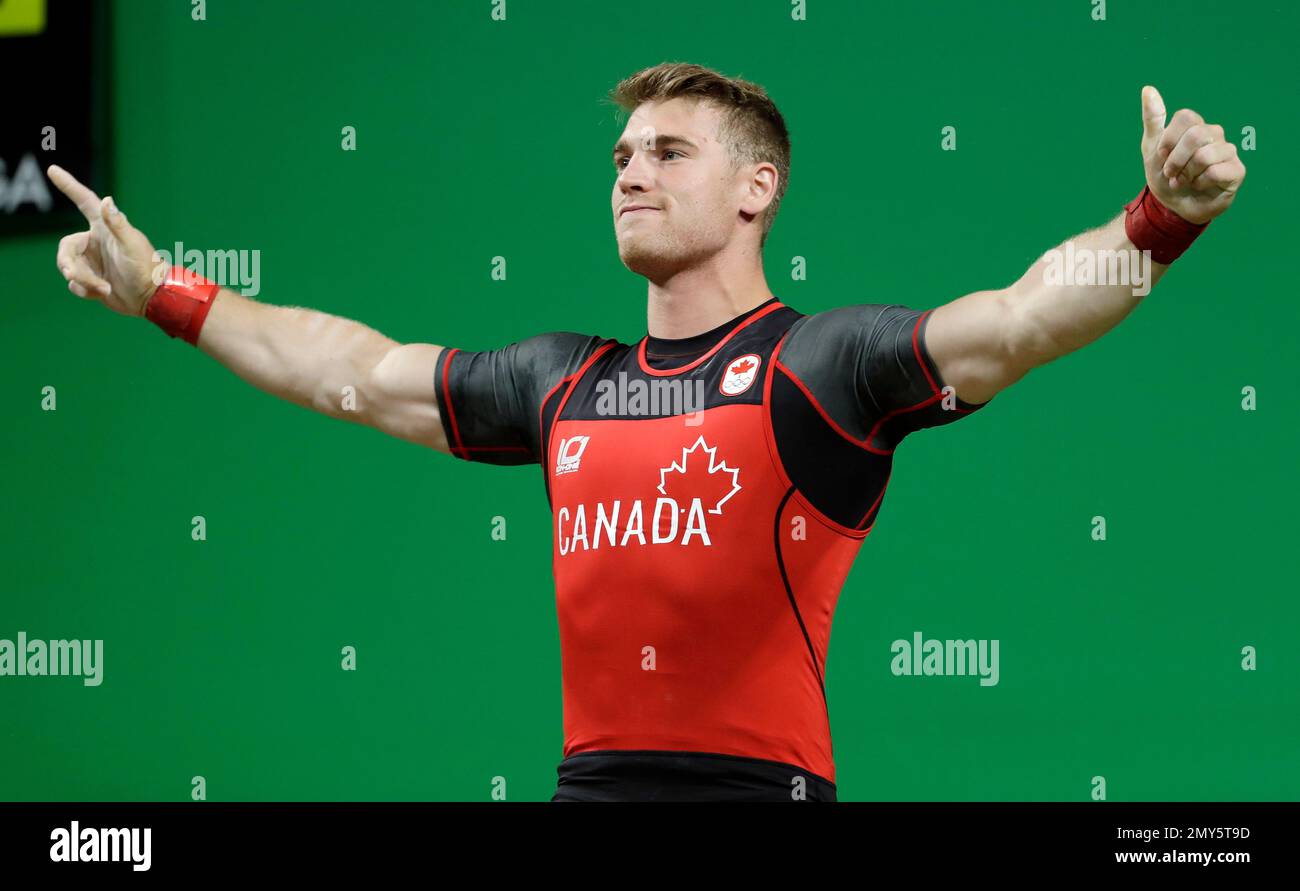 Pascal Plamondon, of Canada, celebrates after a lift during the men's ...