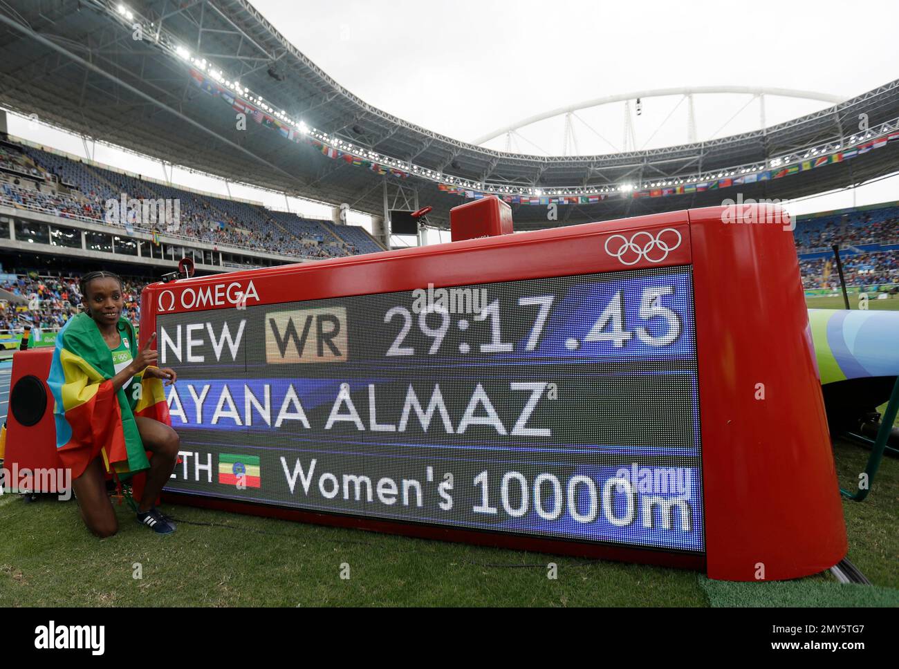 Ethiopia's Almaz Ayana poses next to a scoreboard showing her new world ...