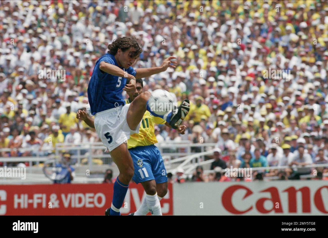 Italy's defender Paolo Maldini (5) directs the ball away from Brazil's ...