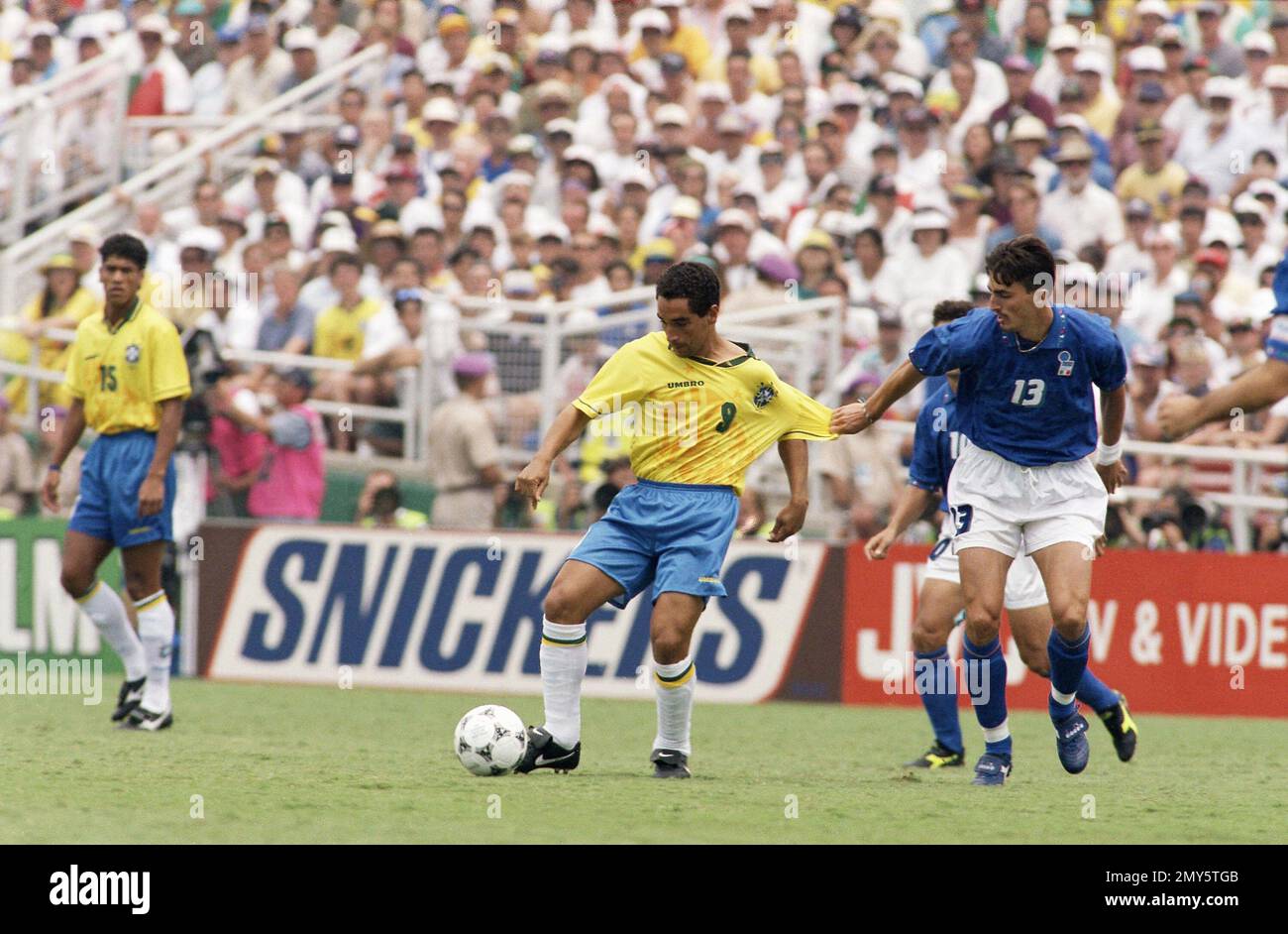 Brazil's Zinho (9) is pulled by Italy's Dino Baggio (13) during first ...