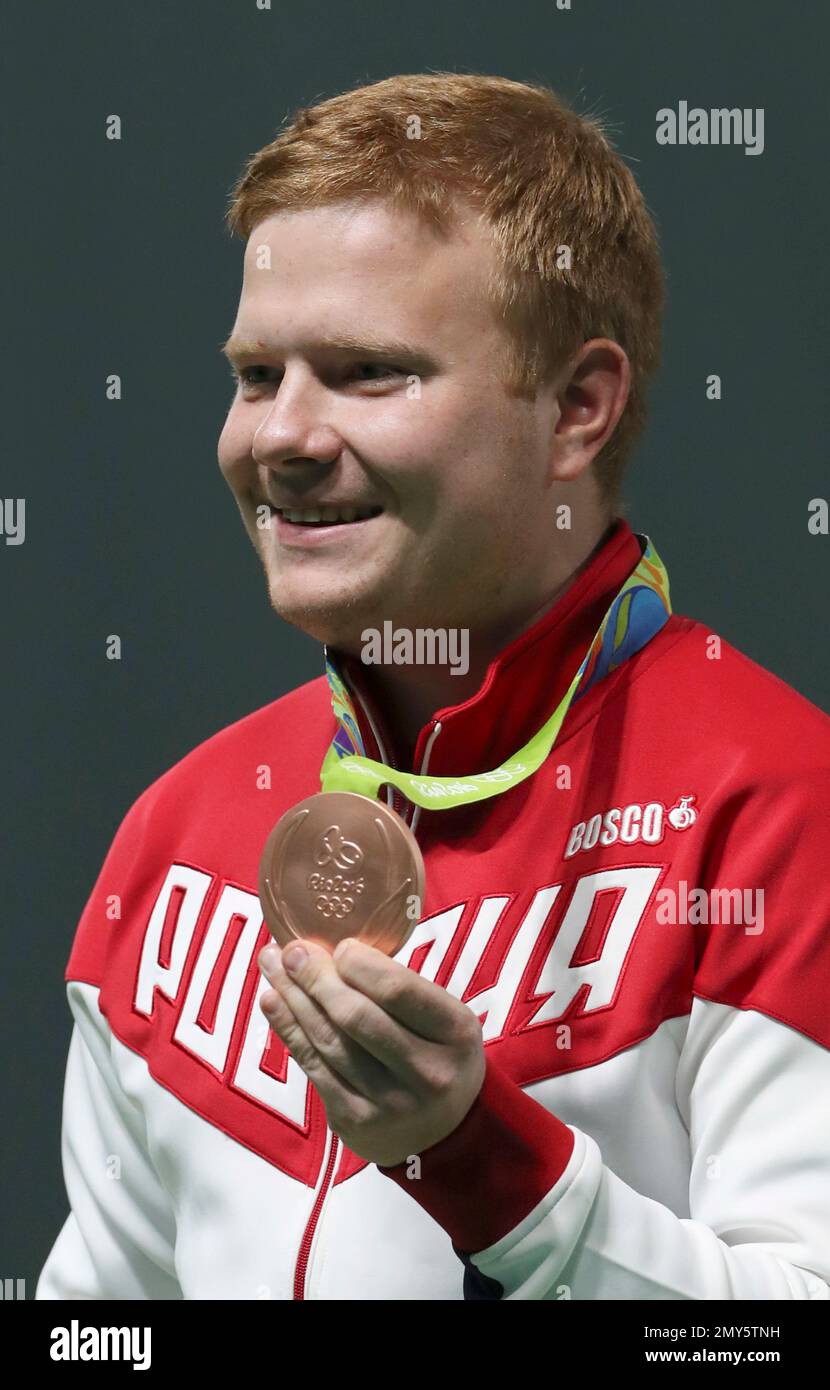 Kirill Grigoryan of Russia shows his bronze medal during the award ...